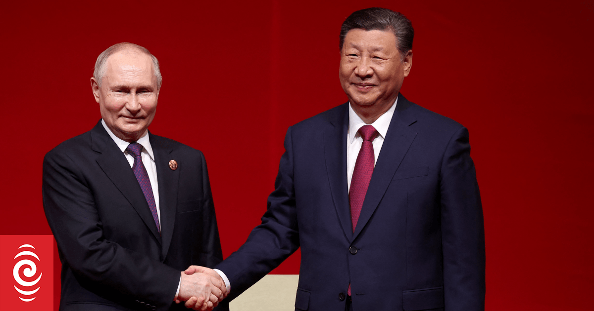 Xi and Putin stand shoulder to shoulder as China casts itself as an ...