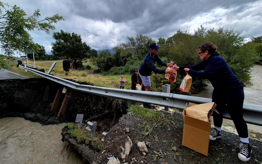 'Lifeline' Lake Ferry Road bridge gouged out by raging floodwaters in ...