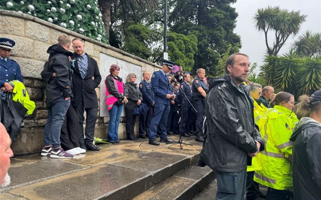 Thousands of people gather at vigil for slain police officer in central ...