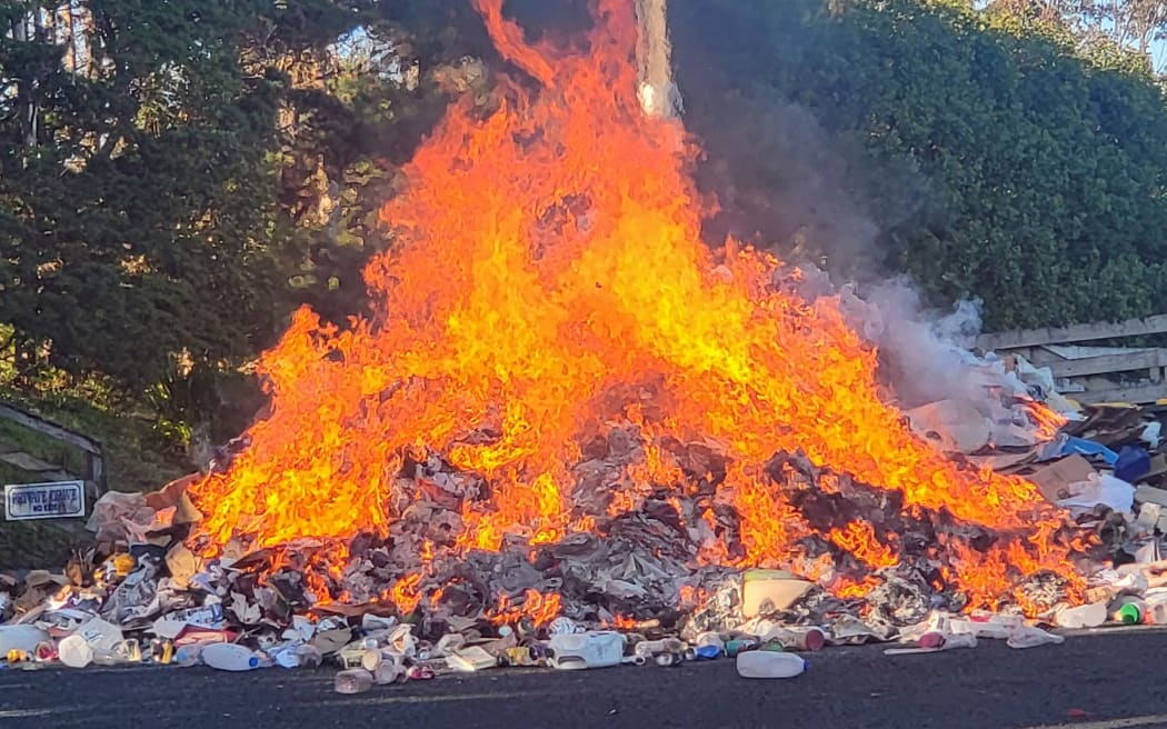 Discarded hazardous household items causing rubbish and recycling truck ...