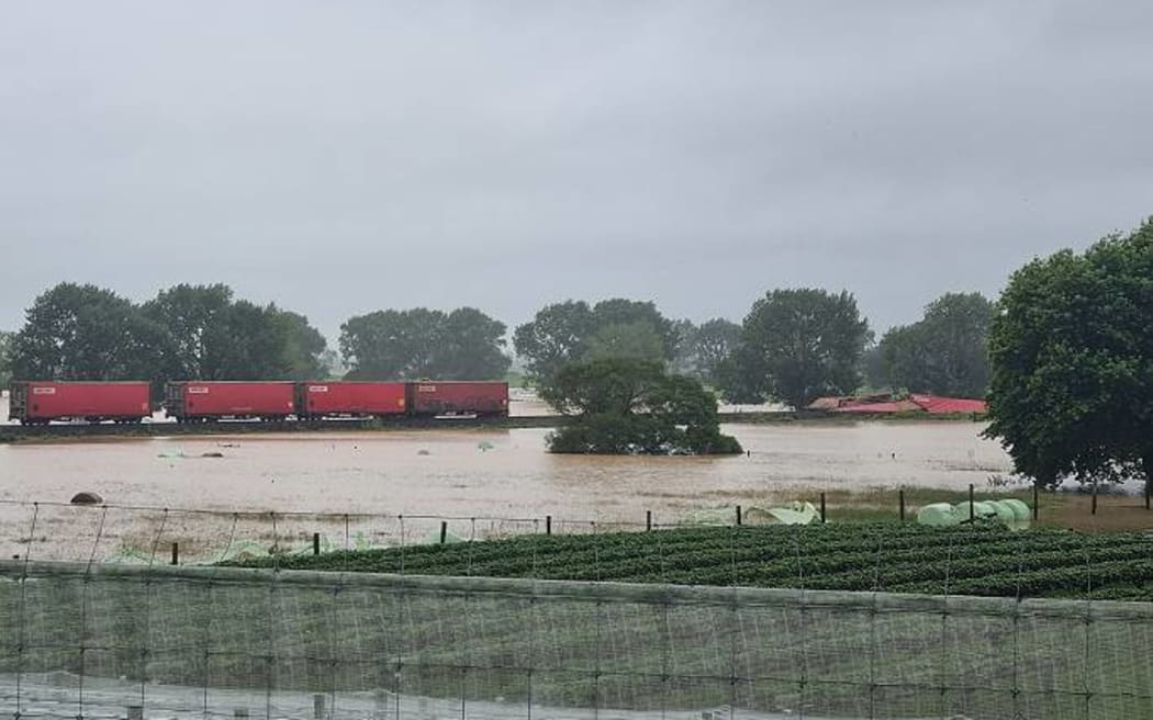 Wild weather in Bay of Plenty: Train derailed, bridge washed out ...