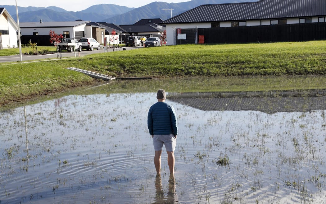 Dad’s drowning fears in flash subdivision as ‘swimming pool’ ponds left ...