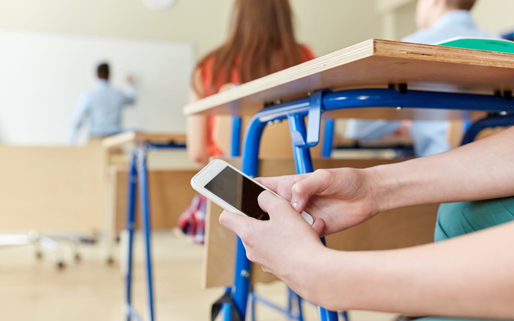 Ban phones in classroom, not during breaks - survey | RNZ News