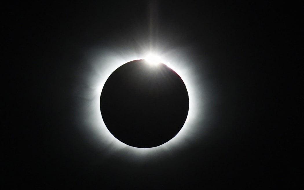 Unusual hybrid solar eclipse visible in parts of NZ on Thursday | RNZ News