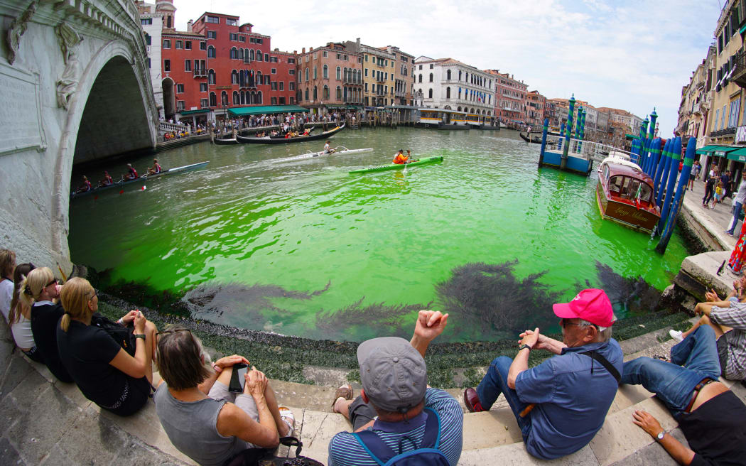 Venice canal patch turns fluorescent green | RNZ News