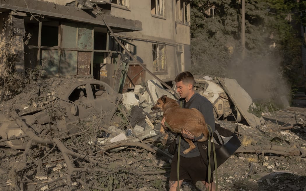 Kyiv hit by deadly Russian strikes, people feared trapped in apartment ...