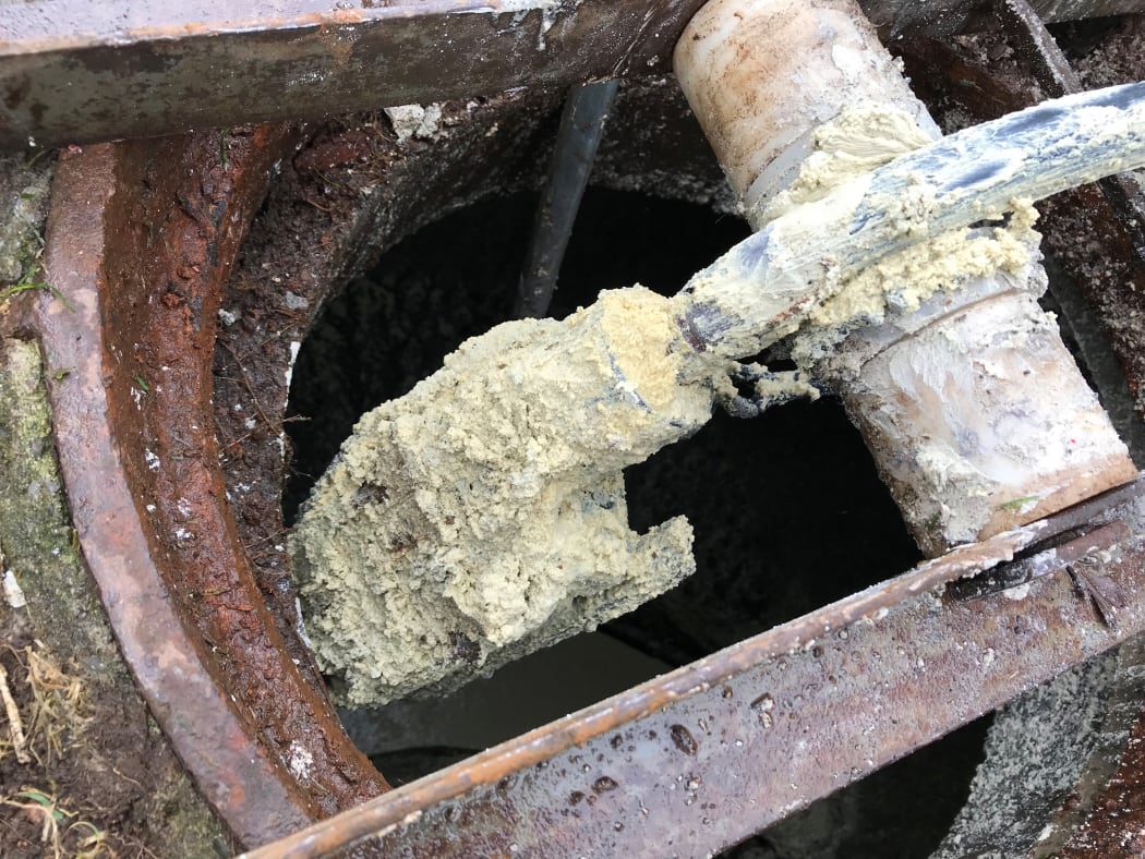 Warnings after fat, sewage discharged onto Taranaki beach | RNZ News