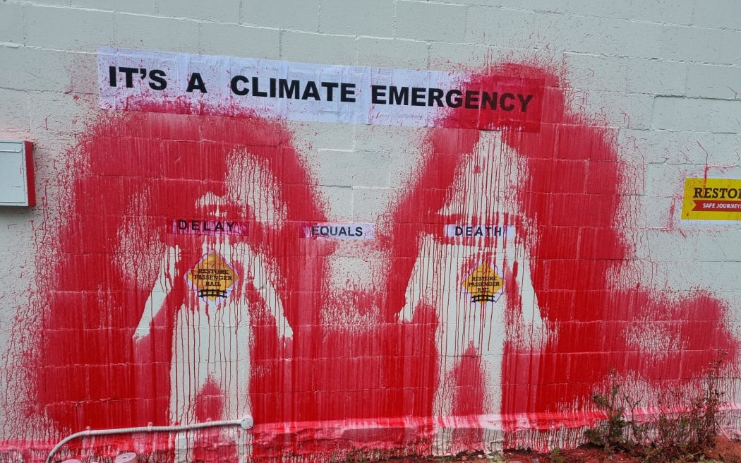 Climate protesters douse MP's offices in red paint | RNZ News