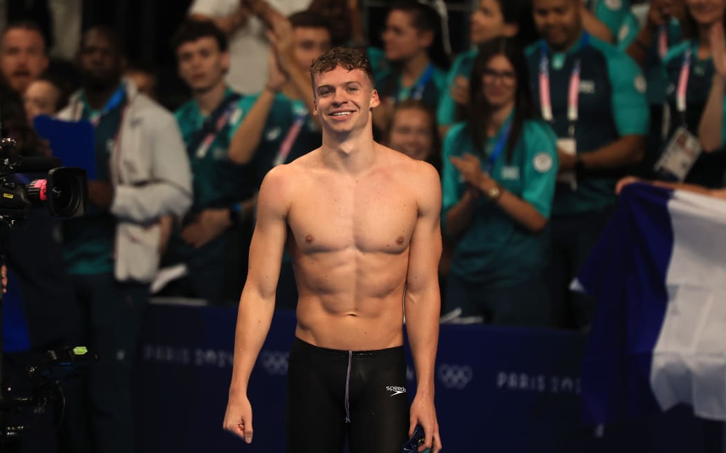 Magic Leon Marchand delivers swimming gold for France | RNZ News