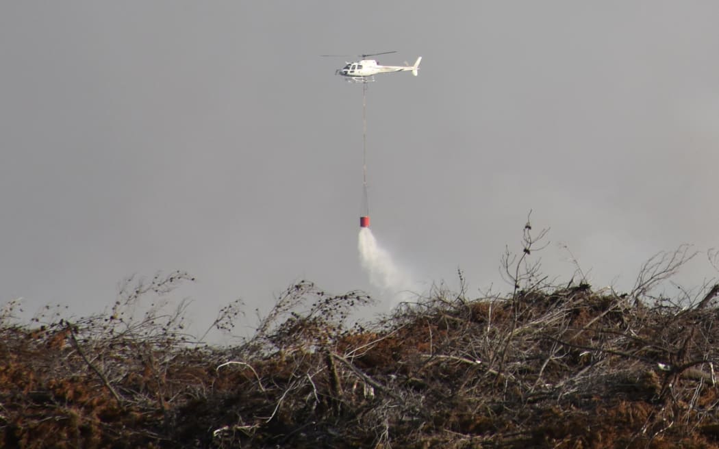 Twizel fire: Seven helicopters fight blaze, wind direction change helps ...