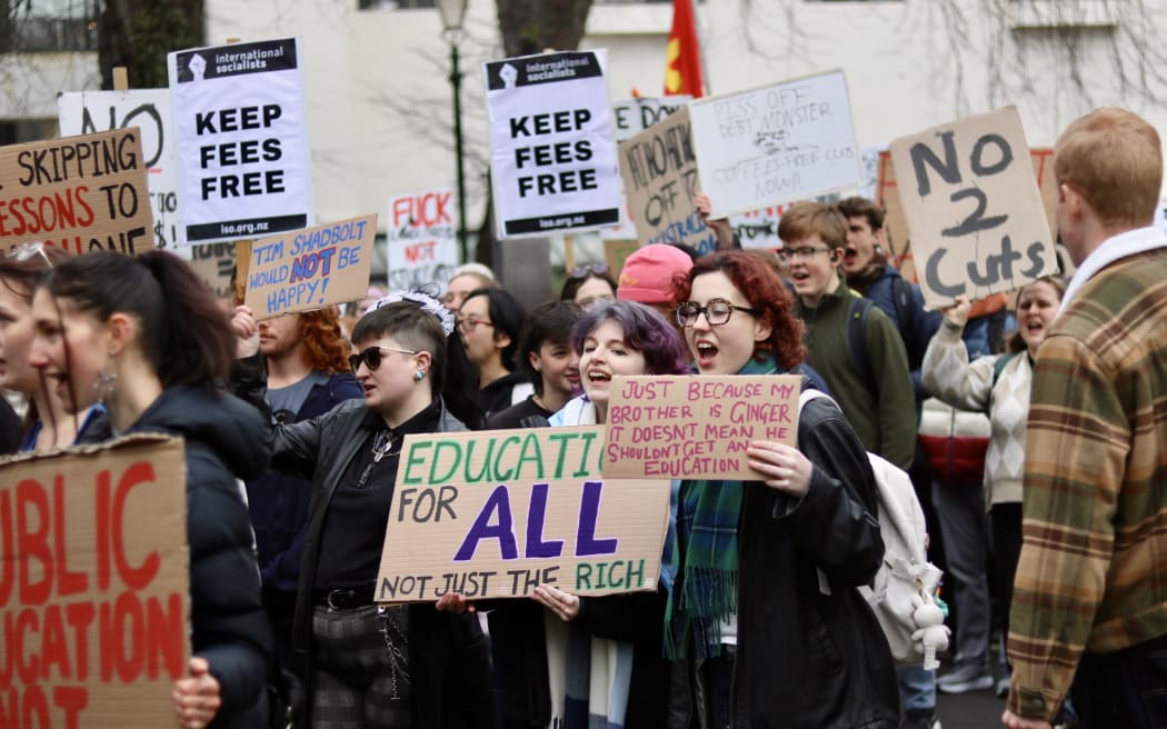 Students accuse government of 'balancing the books' as hundreds protest ...