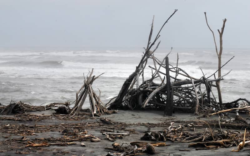 Massive swells could breach old dump filled with asbestos, industrial ...