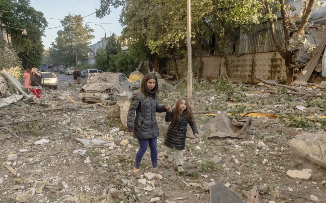 Kyiv hit by deadly Russian strikes, people feared trapped in apartment ...
