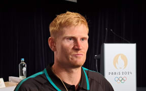 Finn Butcher wins first ever kayak cross Olympic gold | RNZ News