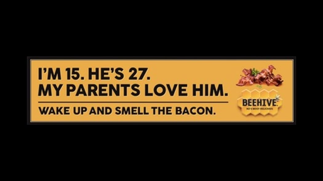 Bacon billboard with statutory rape joke pulled | RNZ News