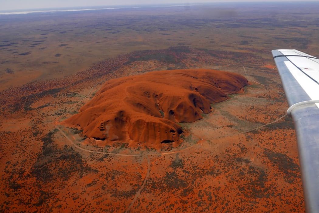 Hundreds climb Uluru on its final day before permanent closure | RNZ News