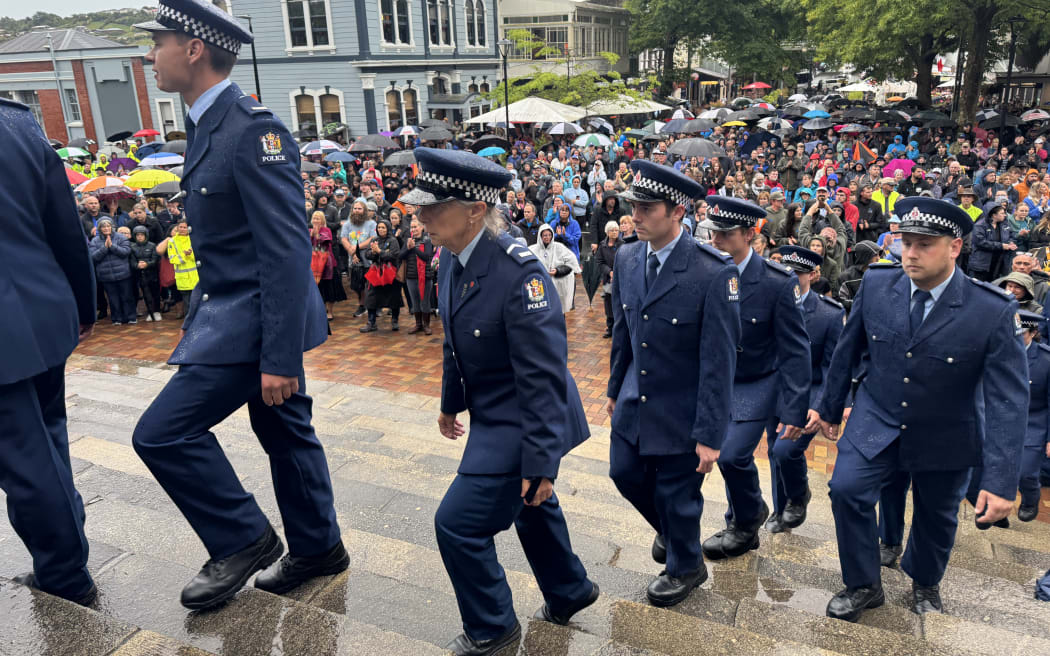Thousands of people gather at vigil for slain police officer in central ...