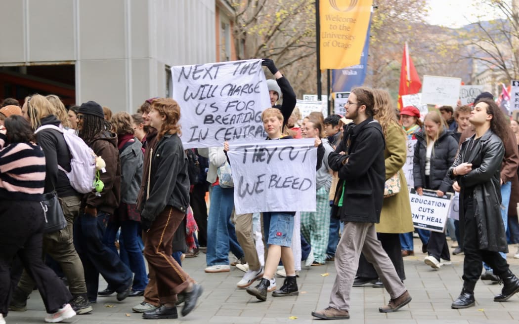 Students accuse government of 'balancing the books' as hundreds protest ...
