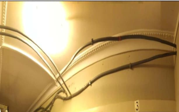 Woman fined over illegal boarding house with exposed wiring, no working ...