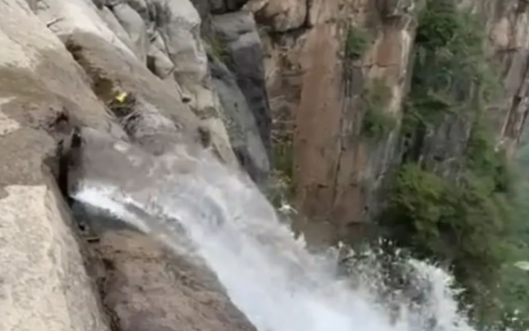 Questions after hidden pipe spotted at famous China waterfall | RNZ News