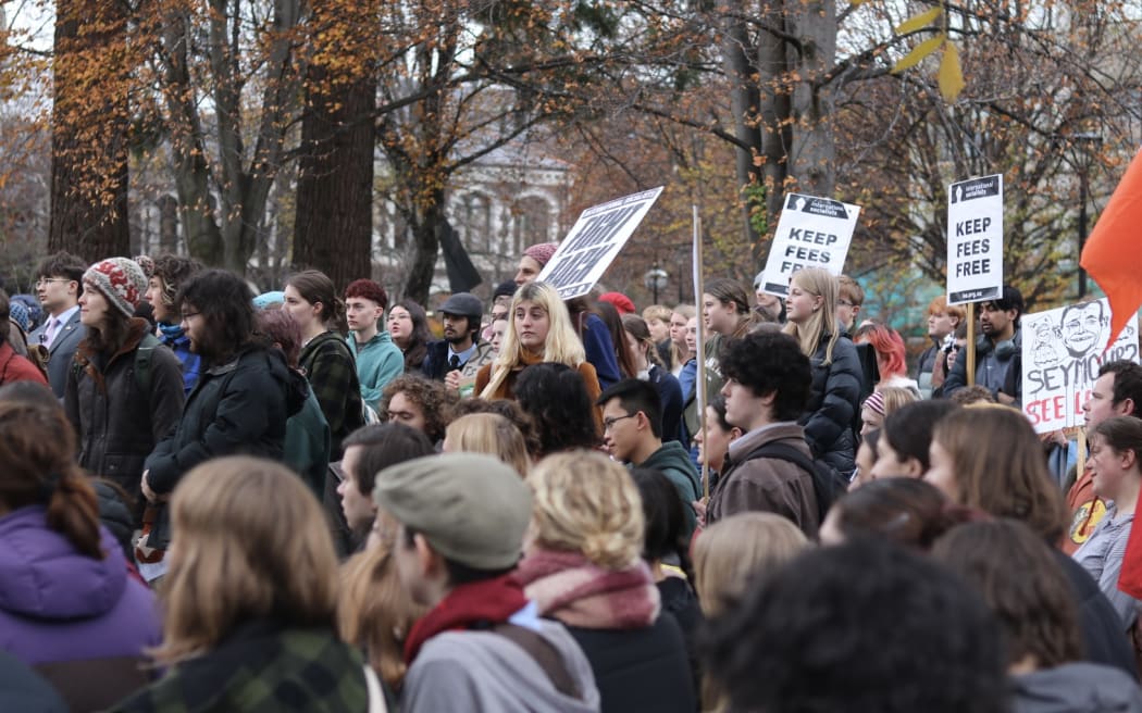 Students accuse government of 'balancing the books' as hundreds protest ...